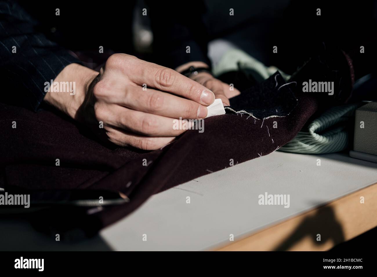 tailor's hand with chalk. preparation of the sewing product Stock Photo ...