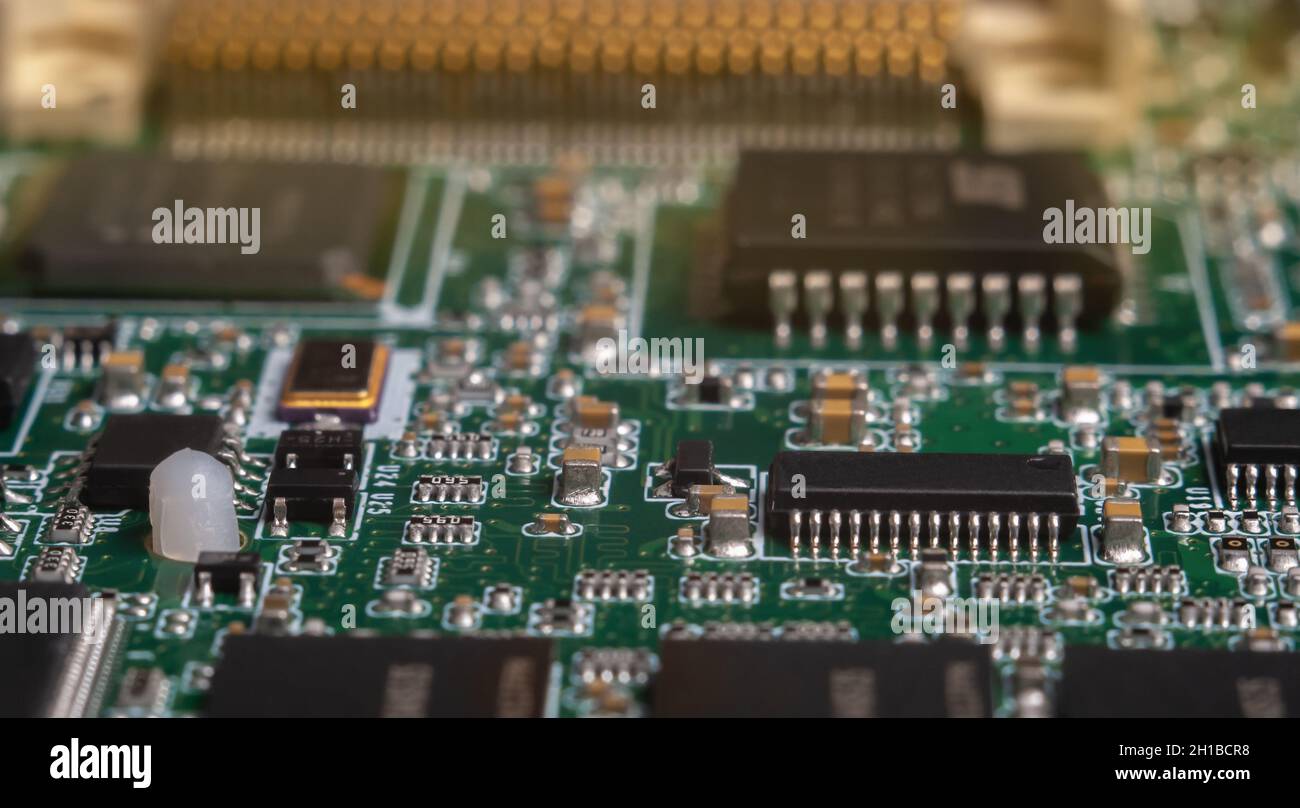 printed circuit board with surface mounted passive and active circuit components close up Stock ...