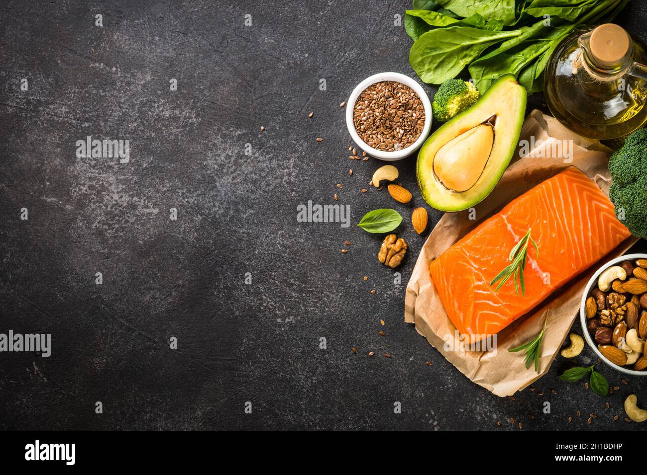 Healthy fats products at black background Stock Photo - Alamy