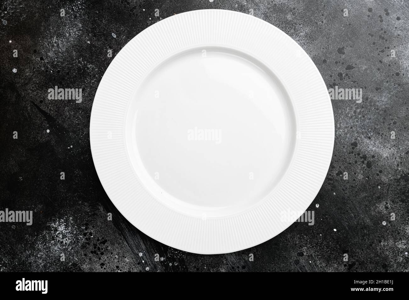 Porcelain empty white plate set with copy space for text or food with ...