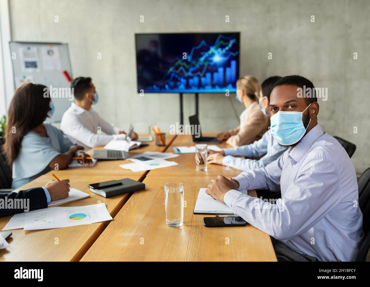 New Normal. Diverse Business People In Face Masks Having Conference In ...