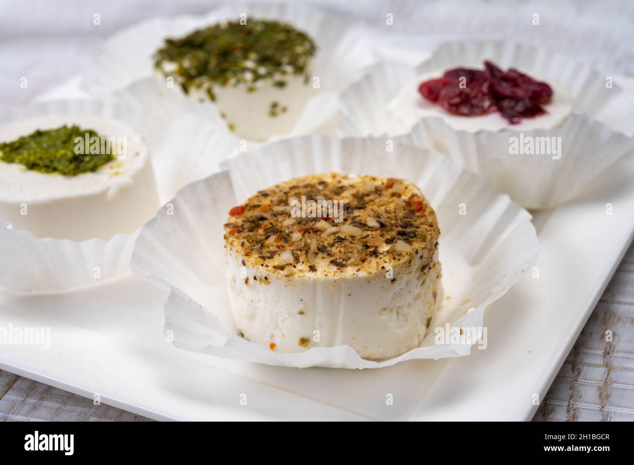Cheese collection, variety of fresh white soft goat French cheeses with ...