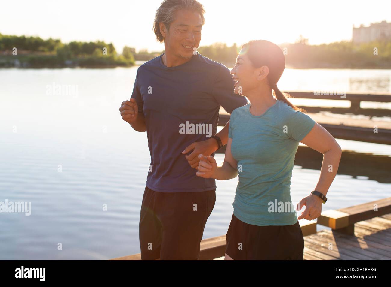 Happy mature chinese couple running hi-res stock photography and images - Alamy