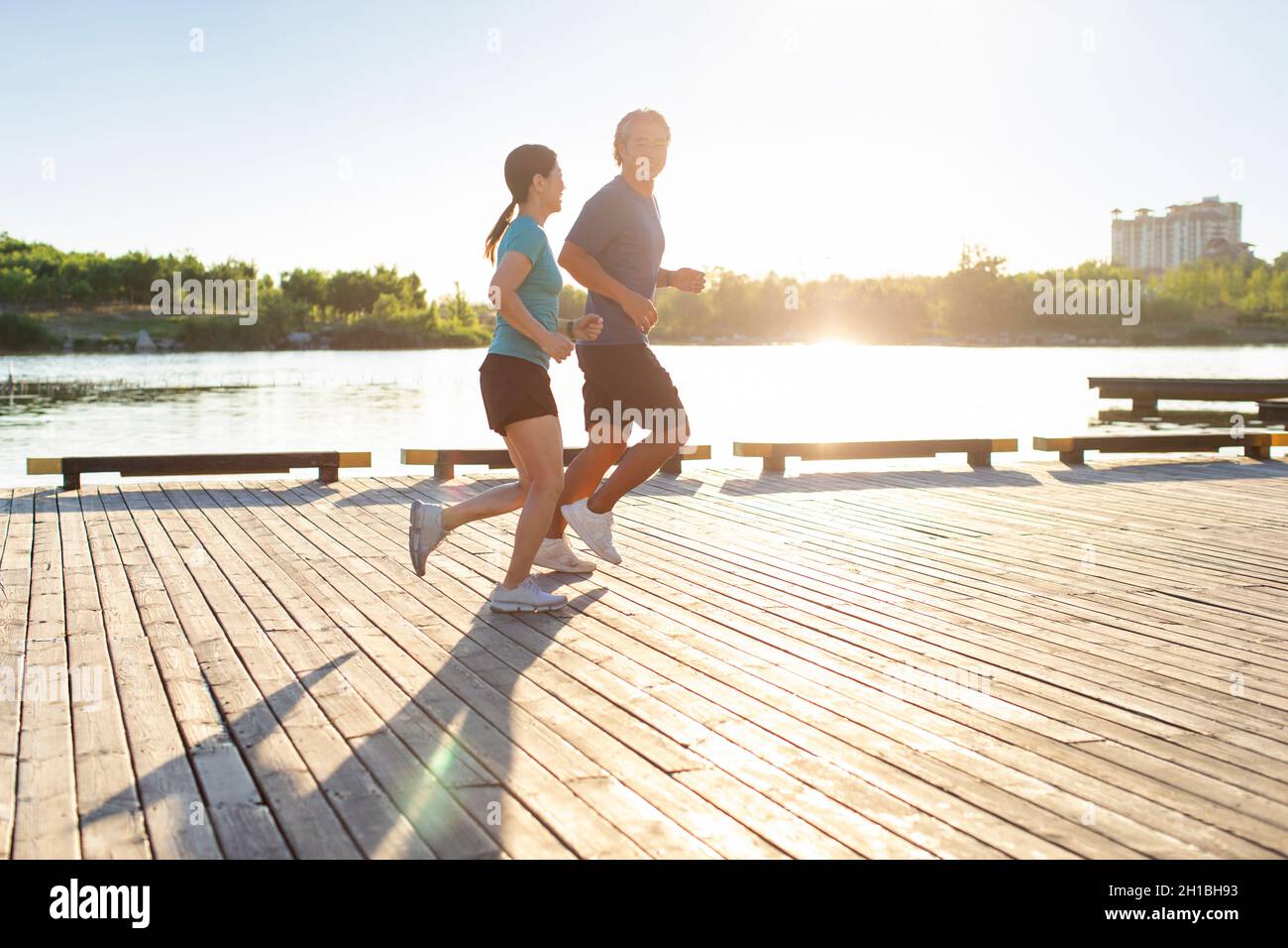 Happy mature chinese couple running hi-res stock photography and images - Alamy