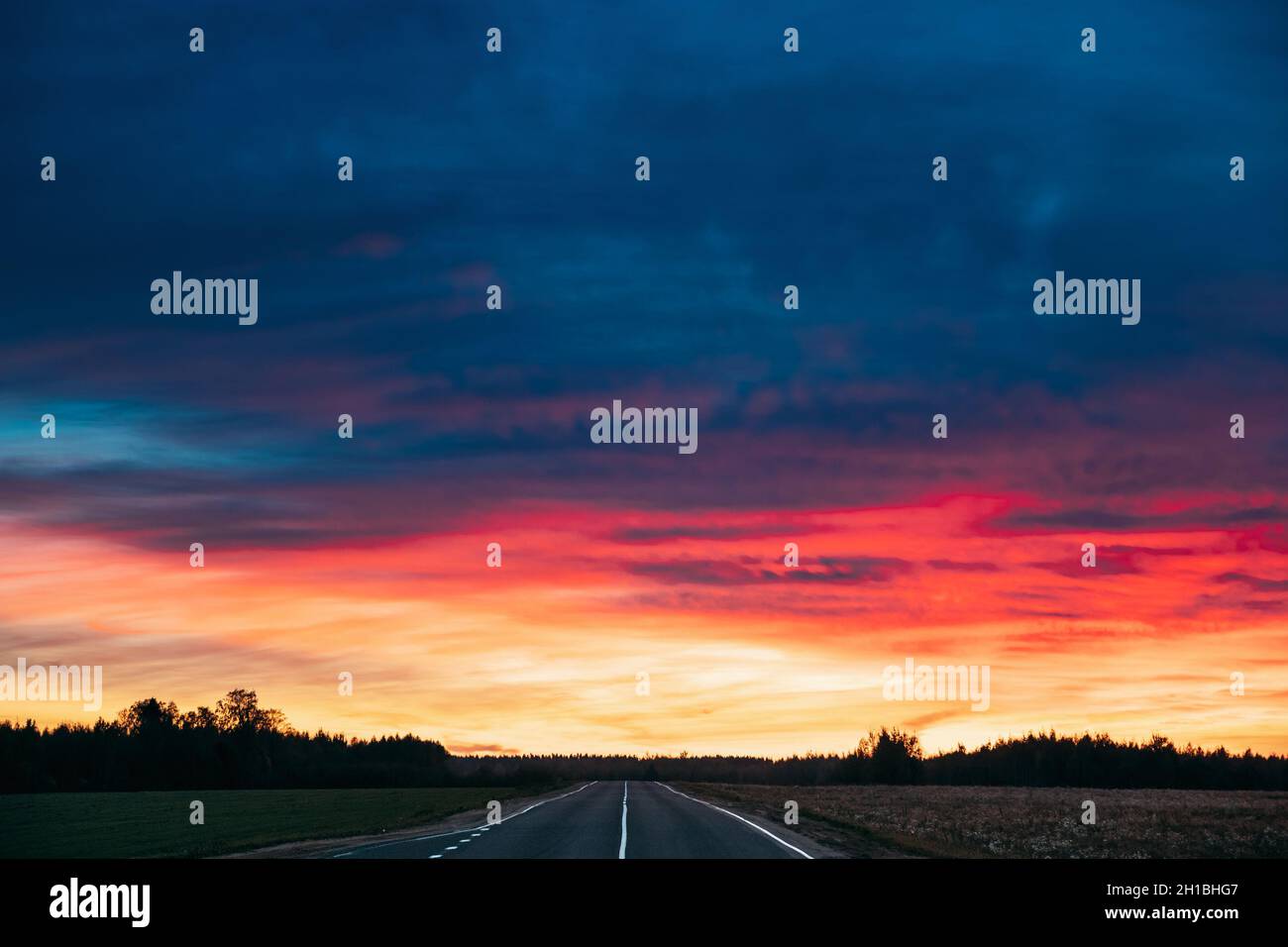 Asphalt Open Road Through Fields And Meadows At Sunset Or Sunris Stock ...