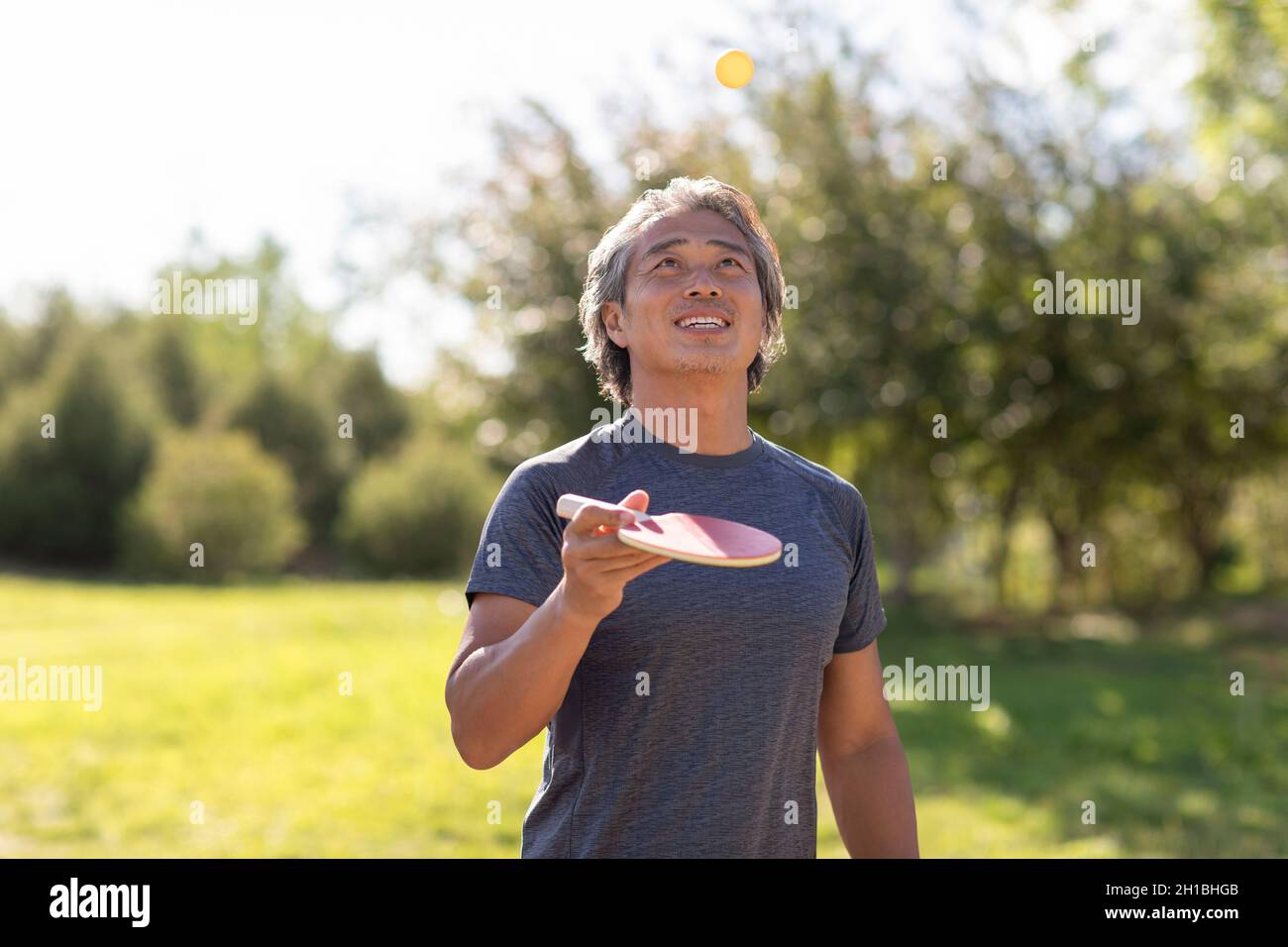 Mature man playing table tennis hi-res stock photography and images - Alamy