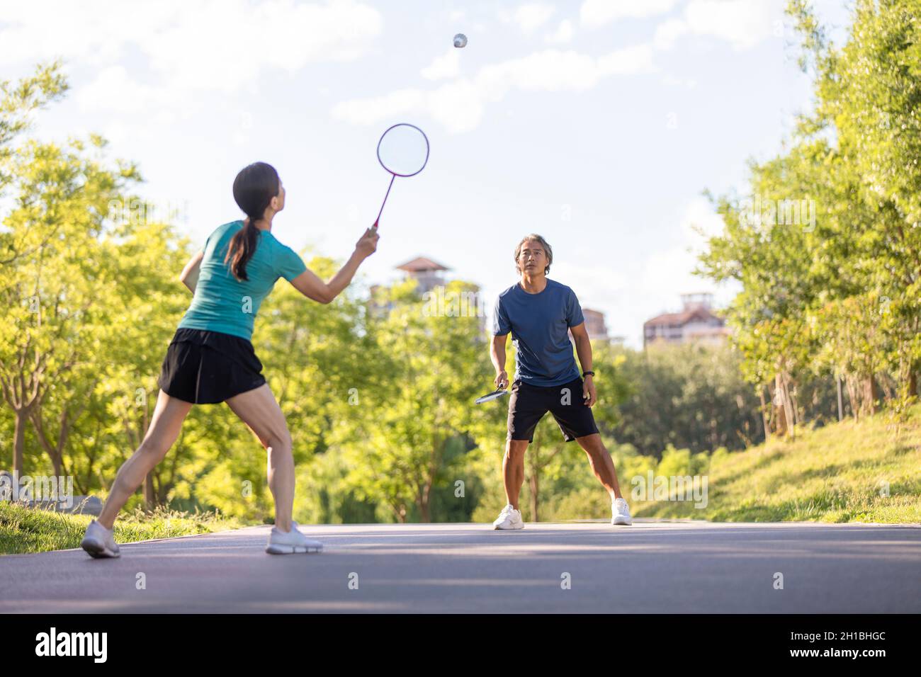 Happy mature couple playing badminton outdoors Stock Photo - Alamy