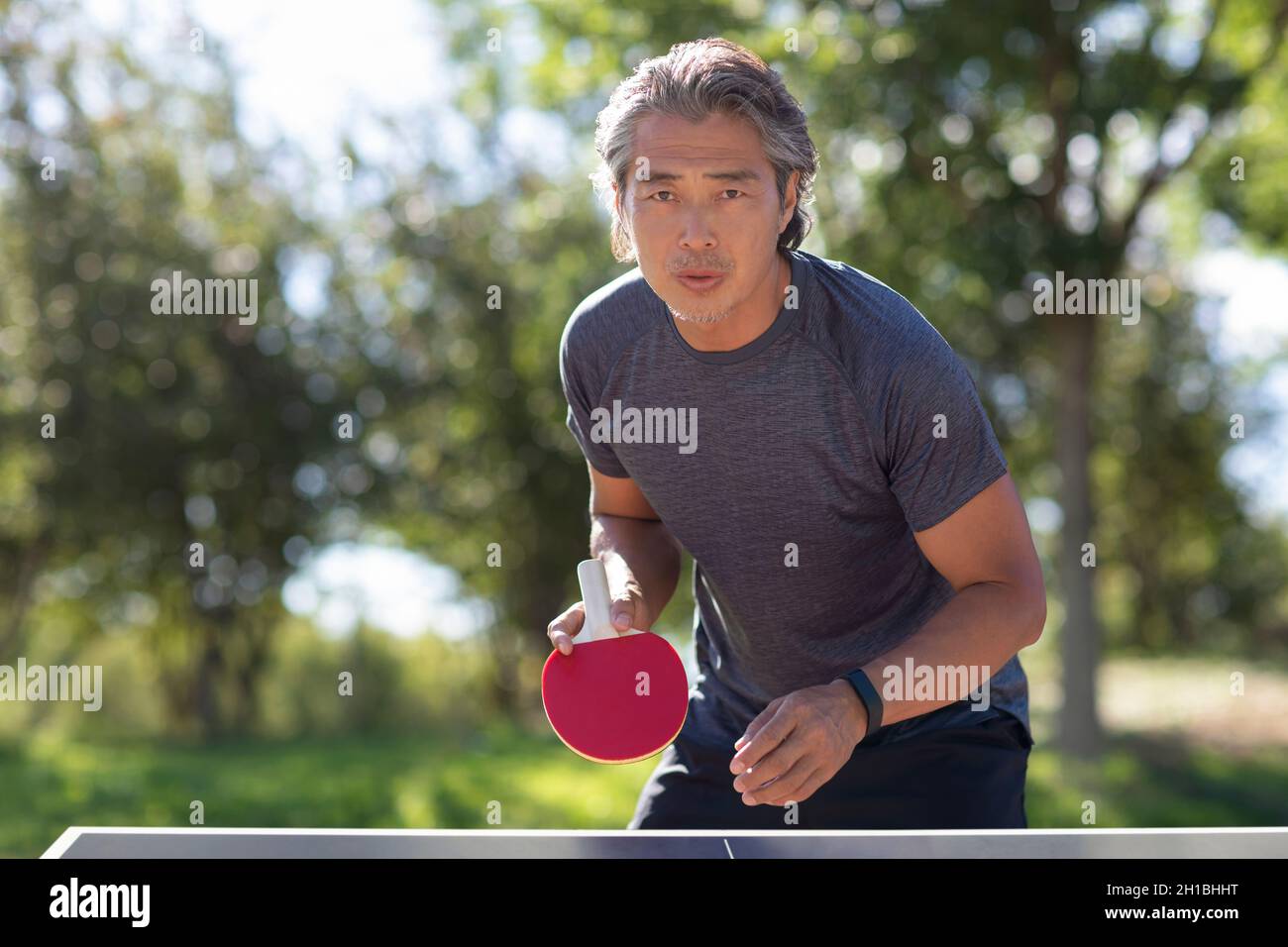 Man playing table tennis outdoors hi-res stock photography and images ...