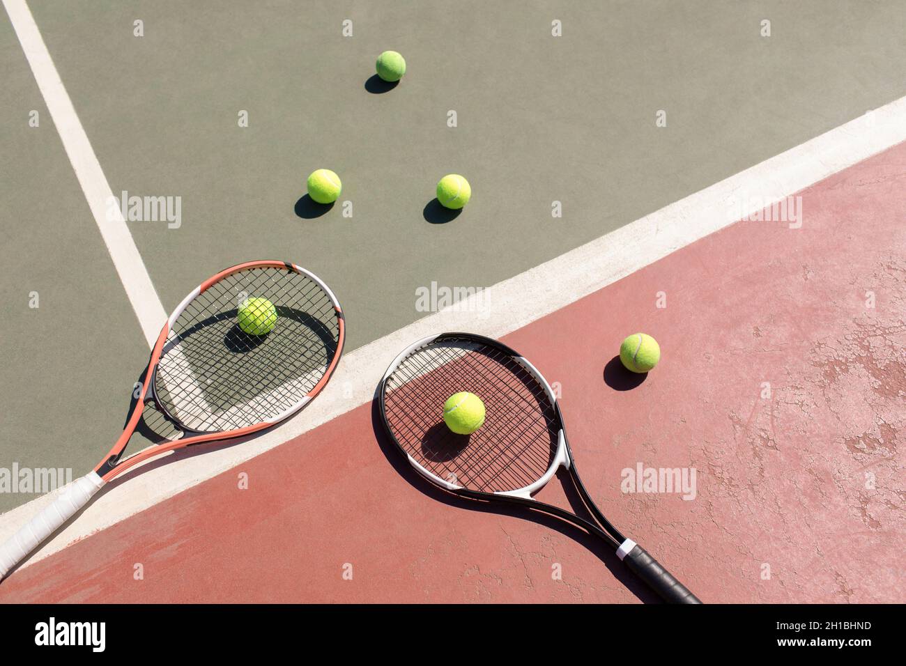 Tennis balls and tennis rackets Stock Photo - Alamy