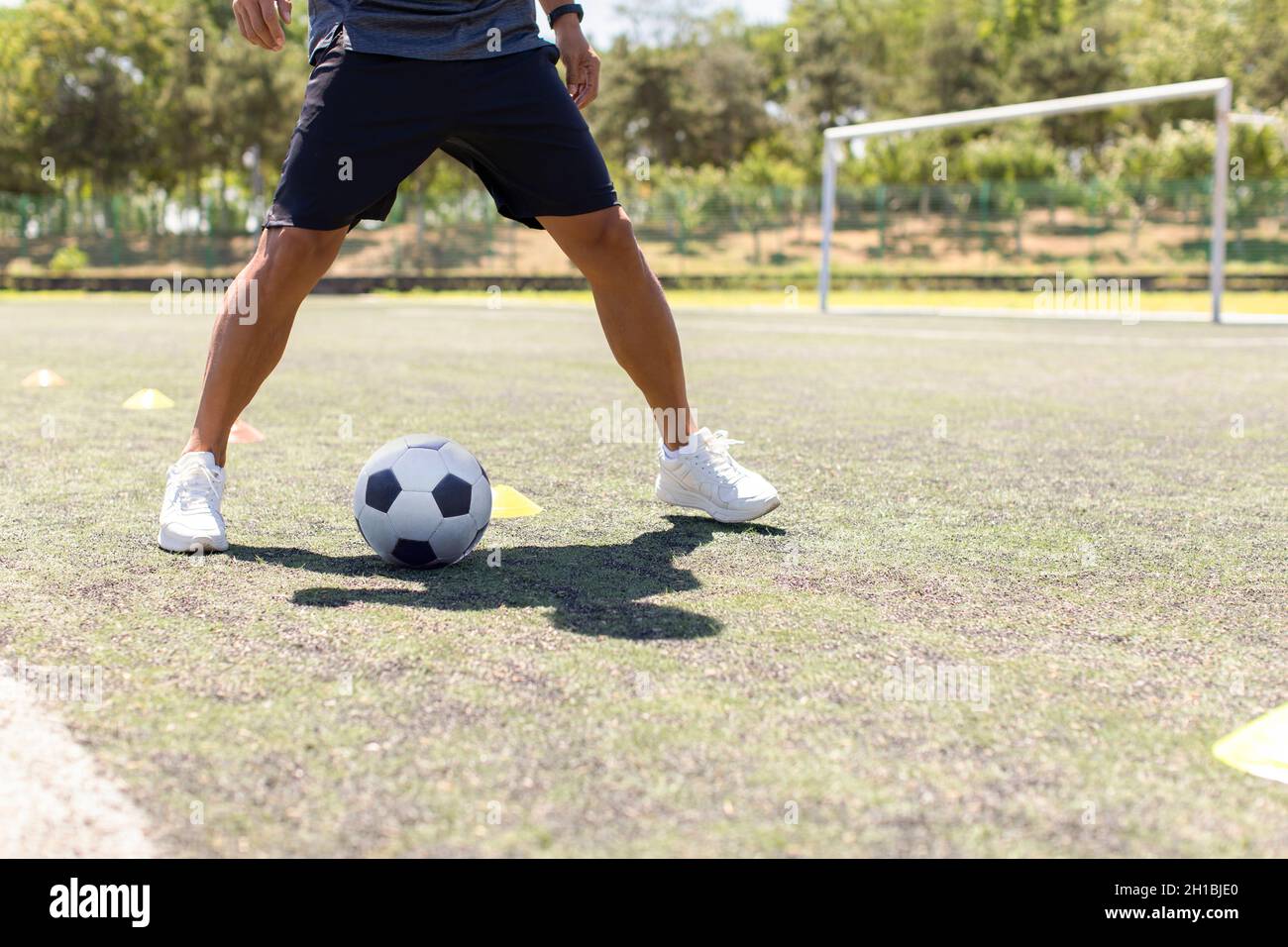Mature man playing football outdoors Stock Photo - Alamy