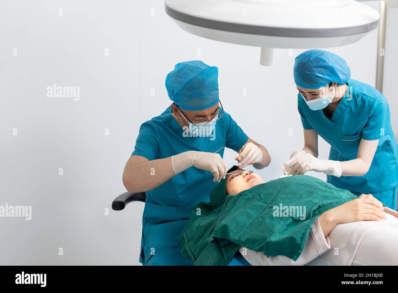 Mid adult woman receiving facial plastic surgery Stock Photo - Alamy