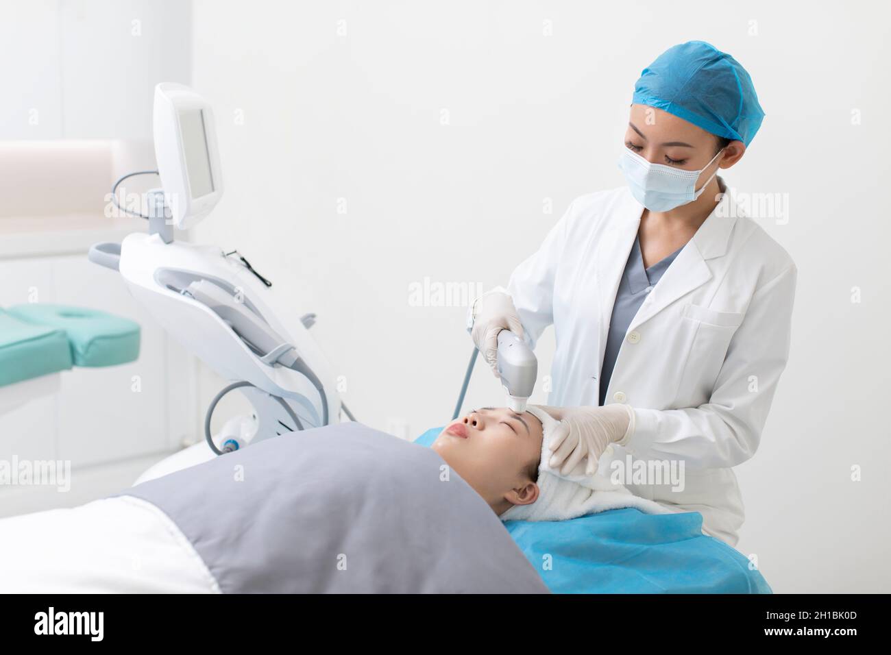 Young woman receiving face treatment in hospital Stock Photo - Alamy