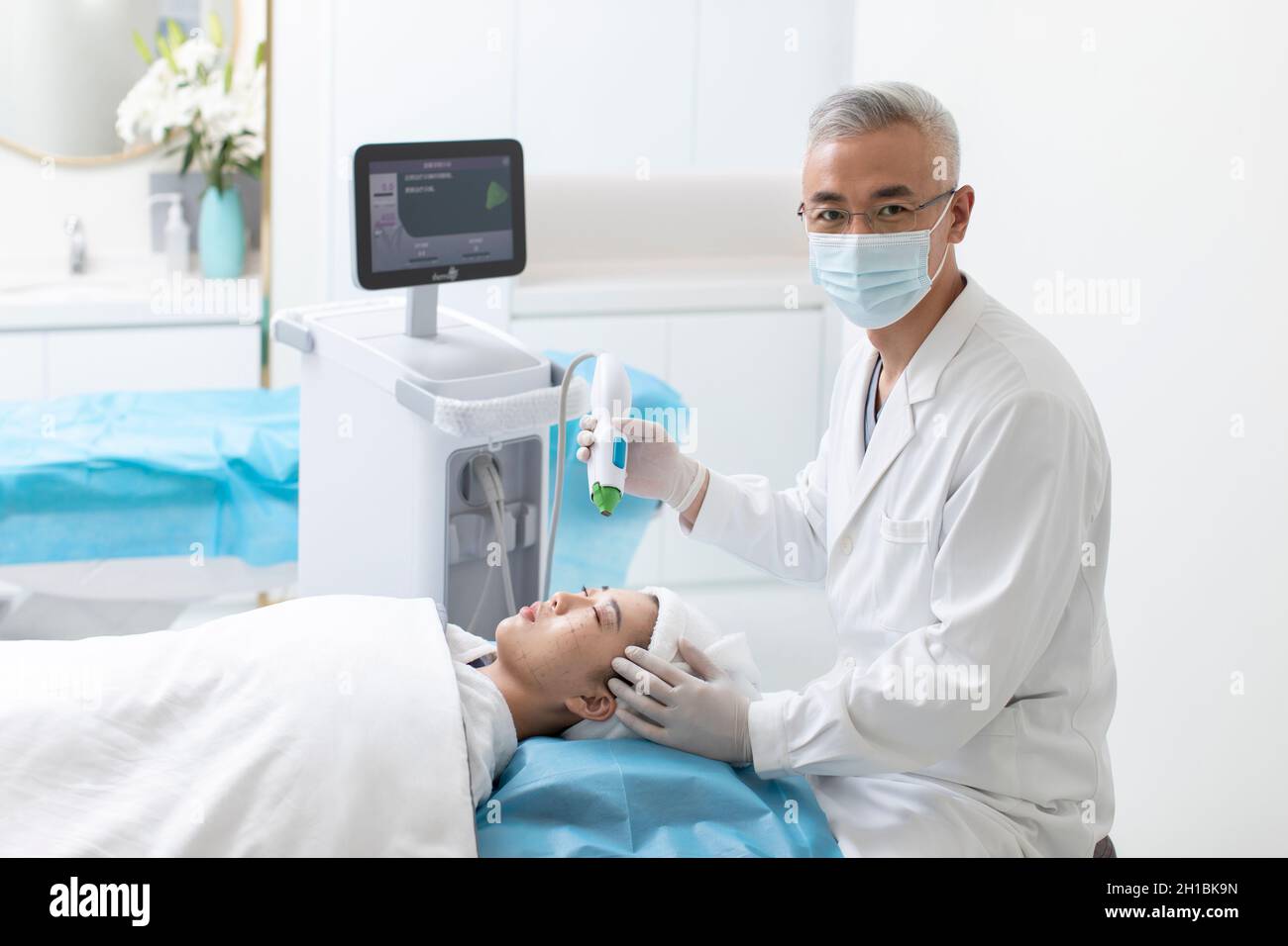 Young woman receiving beauty treatment in hospital Stock Photo - Alamy