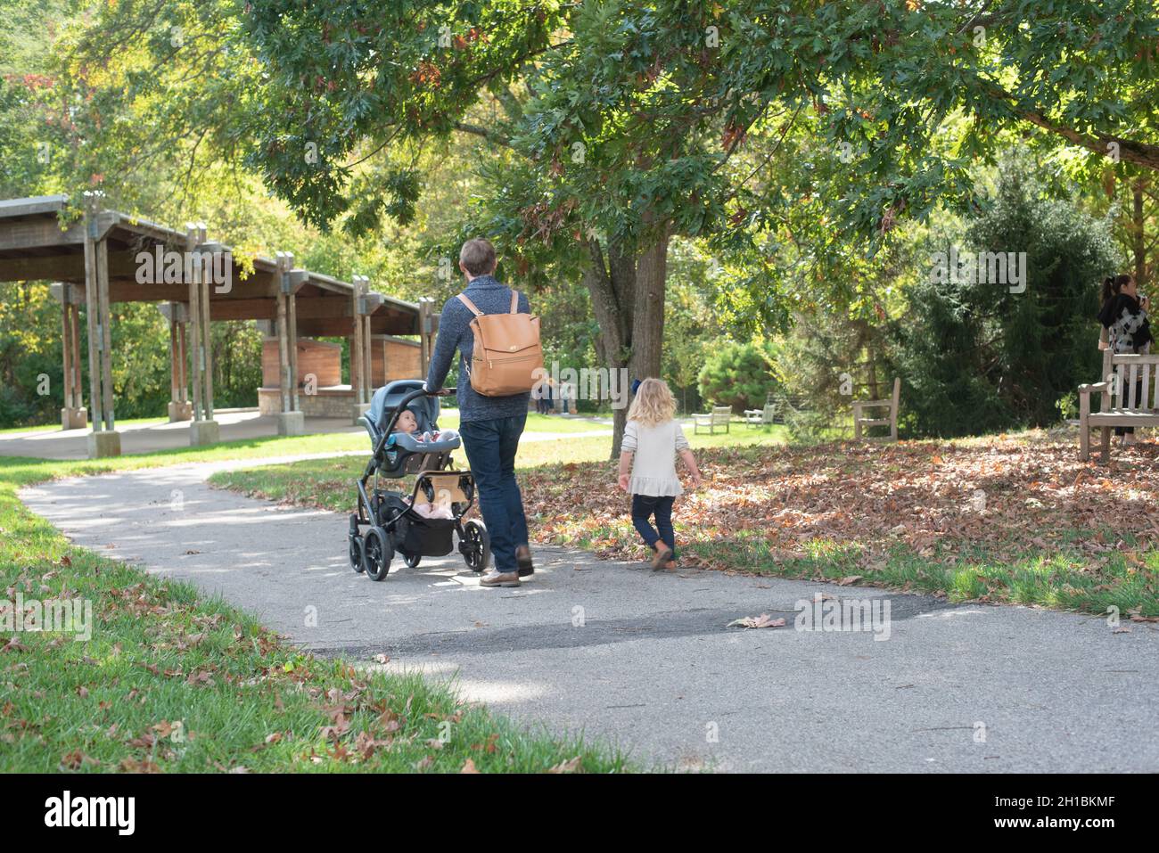 Fall Stroll in the park with dad and two younger children. Fall themed ...