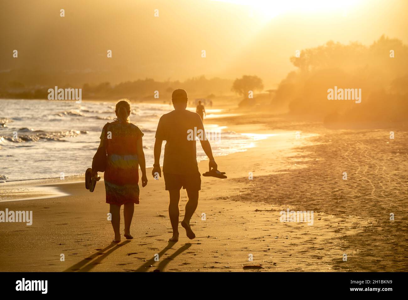 Zakynthos, October 2021: Couple walking the beach of Kalamaki Stock ...