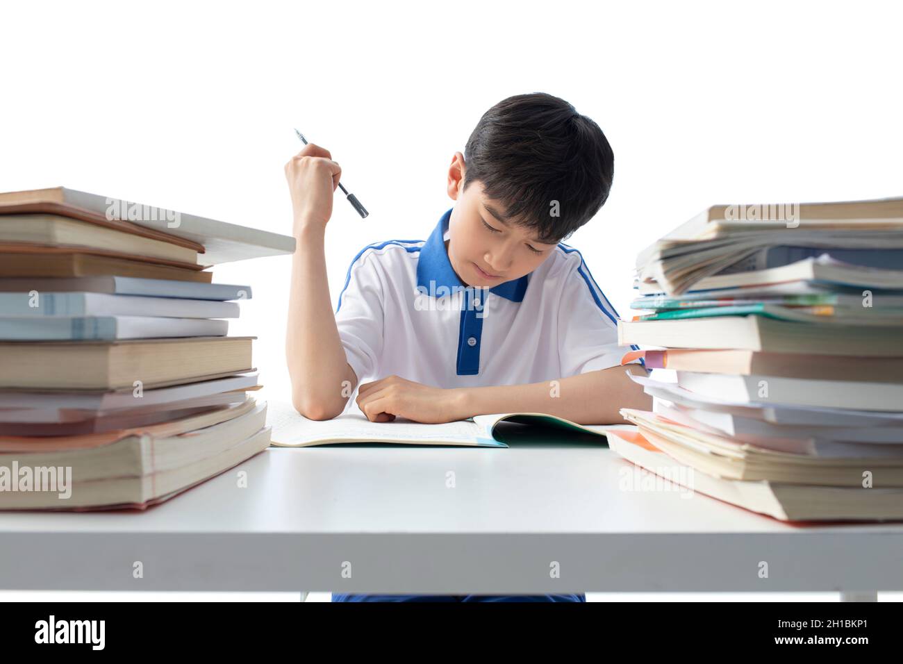 Teenage boy doing homework Stock Photo - Alamy