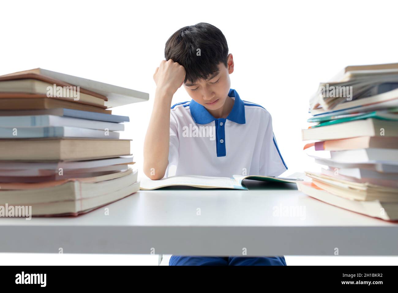 Teenage boy doing homework Stock Photo - Alamy