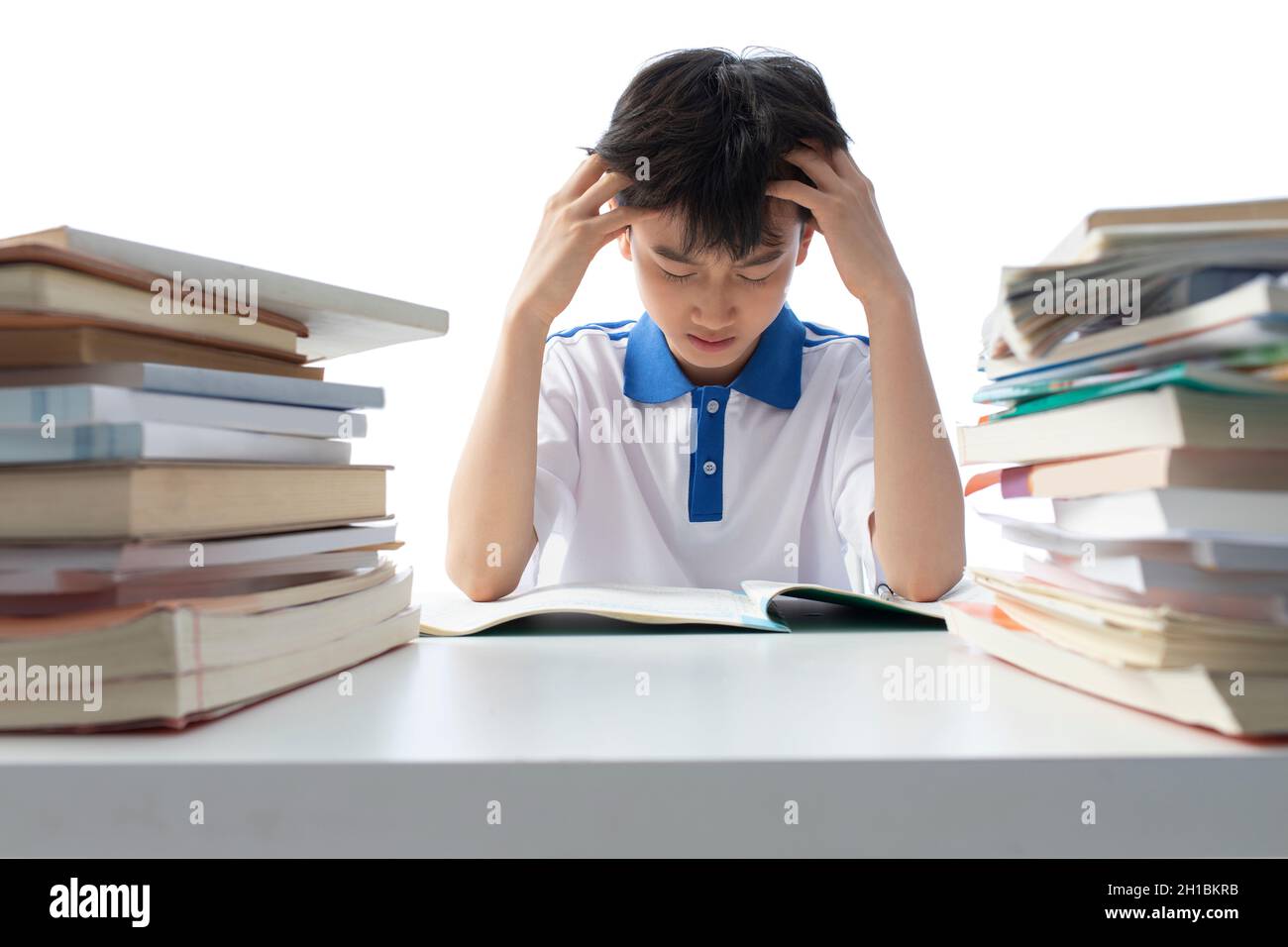 Teenage boy doing homework Stock Photo - Alamy