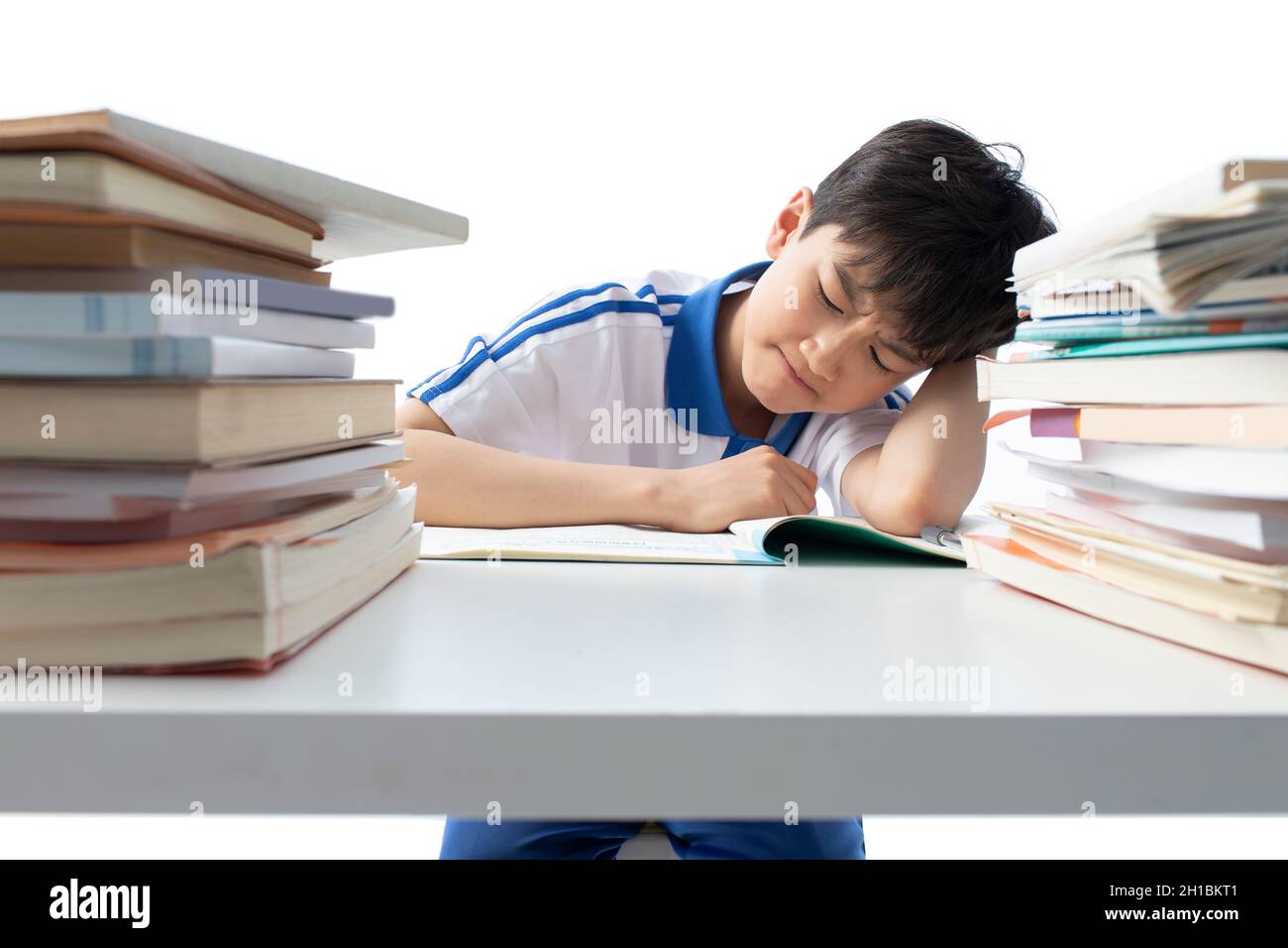 Teenage boy doing homework Stock Photo - Alamy