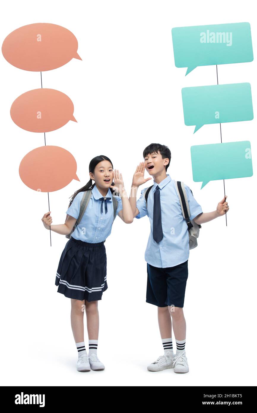 Cheerful students holding speech bubbles Stock Photo - Alamy