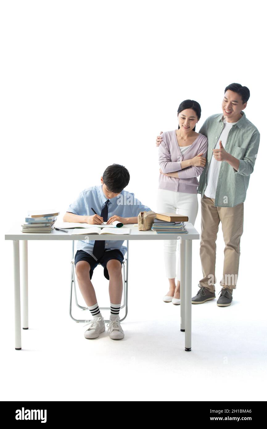 Happy parents looking at their son Stock Photo - Alamy