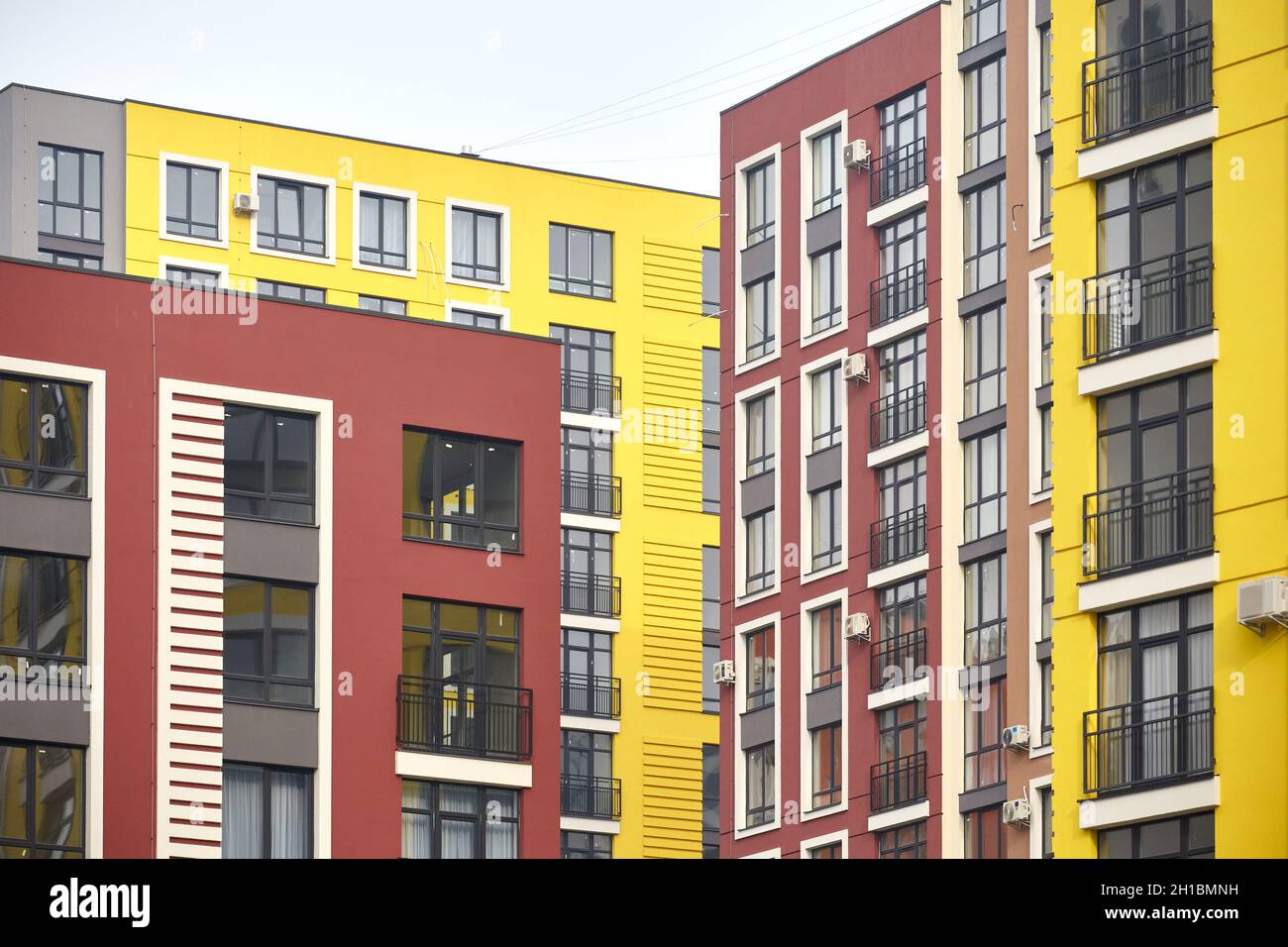 View of the facades of multi-colored multi-storey residential buildings ...