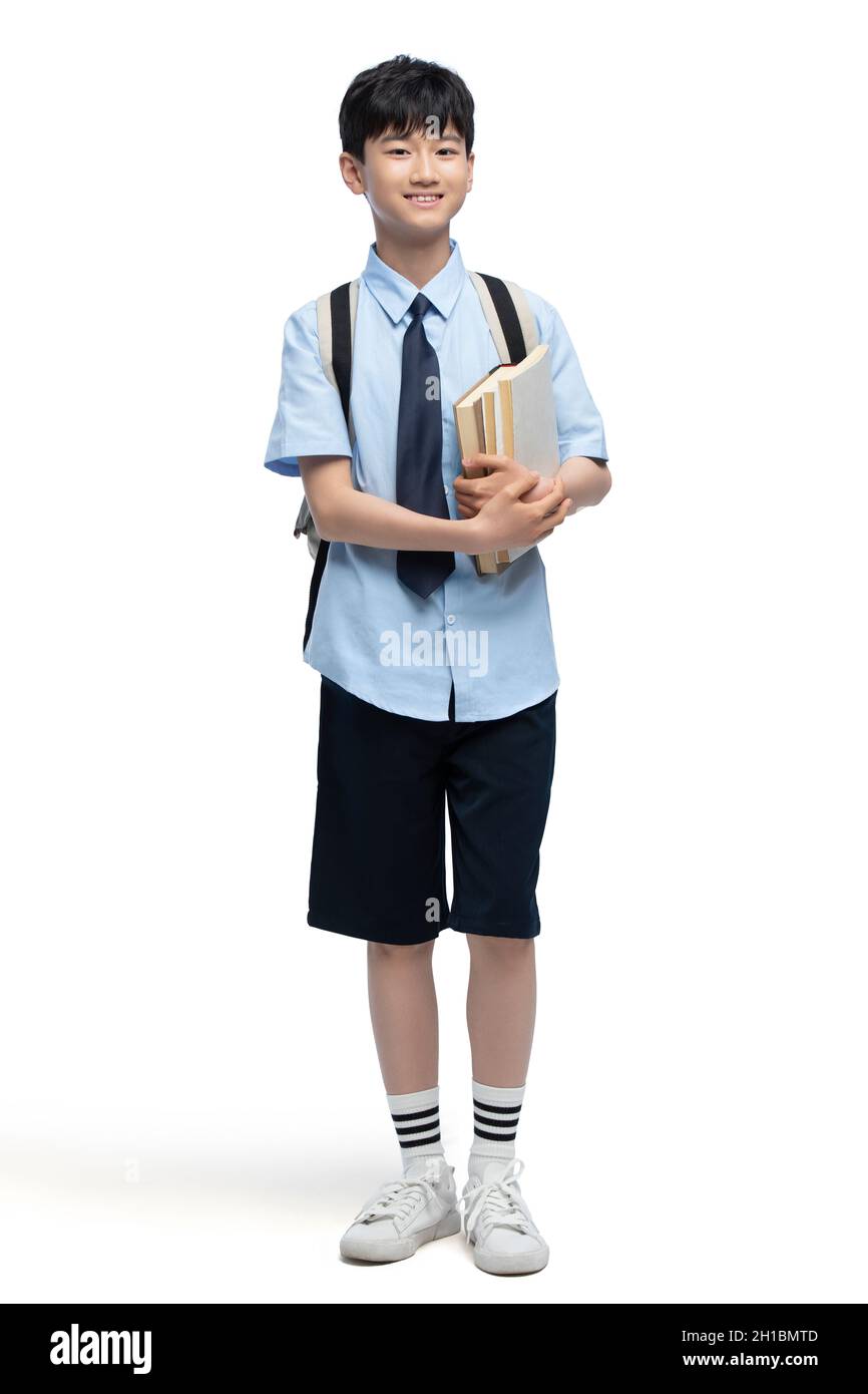 Portrait of cheerful schoolboy with books Stock Photo - Alamy