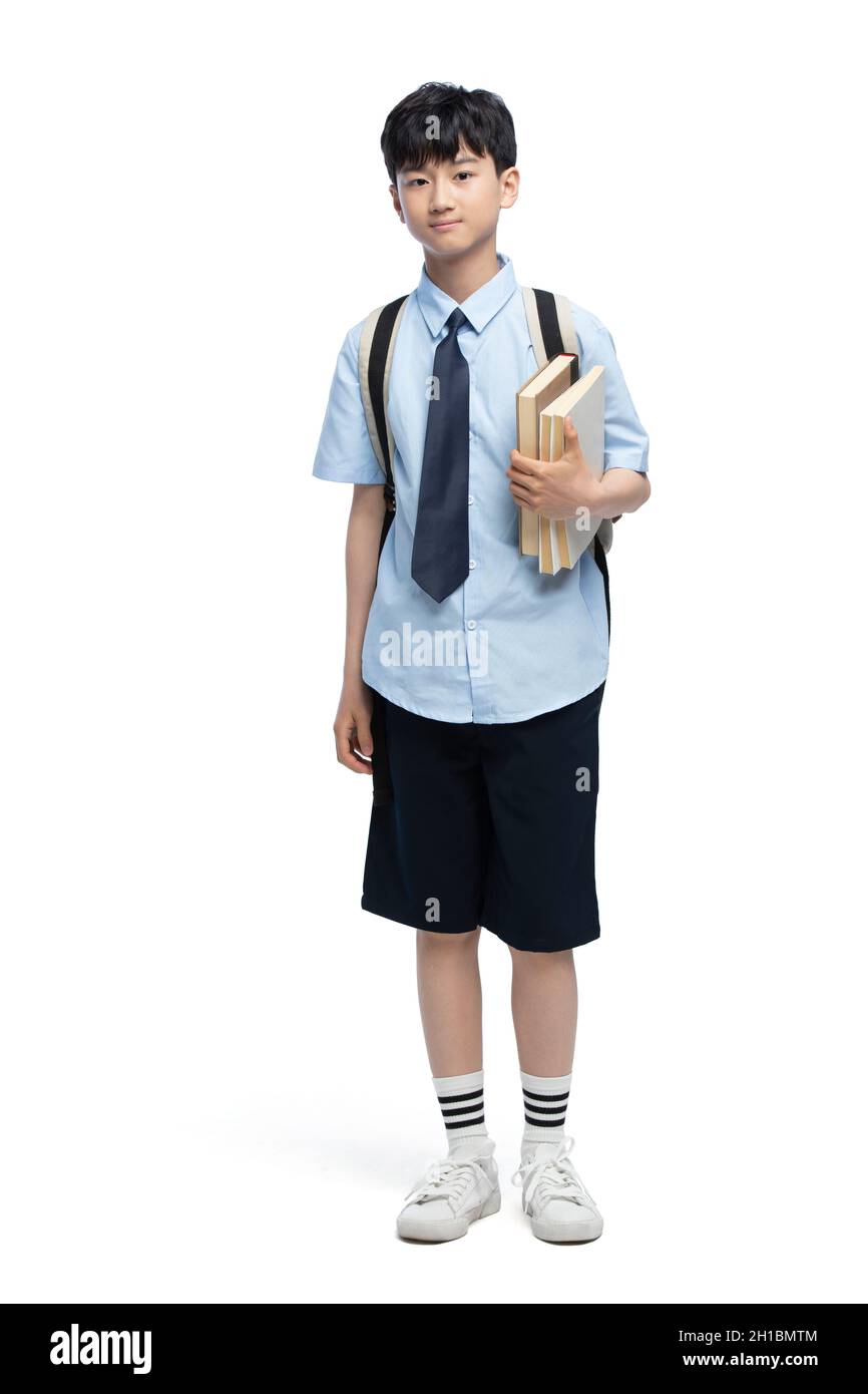 Portrait of cheerful schoolboy with books Stock Photo - Alamy