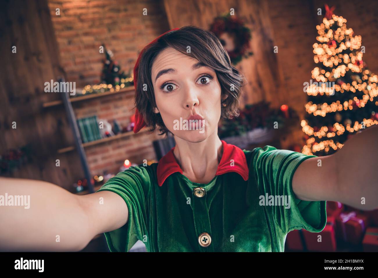 Photo of cute shocked young lady wear elf clothes drinking wine tacking ...