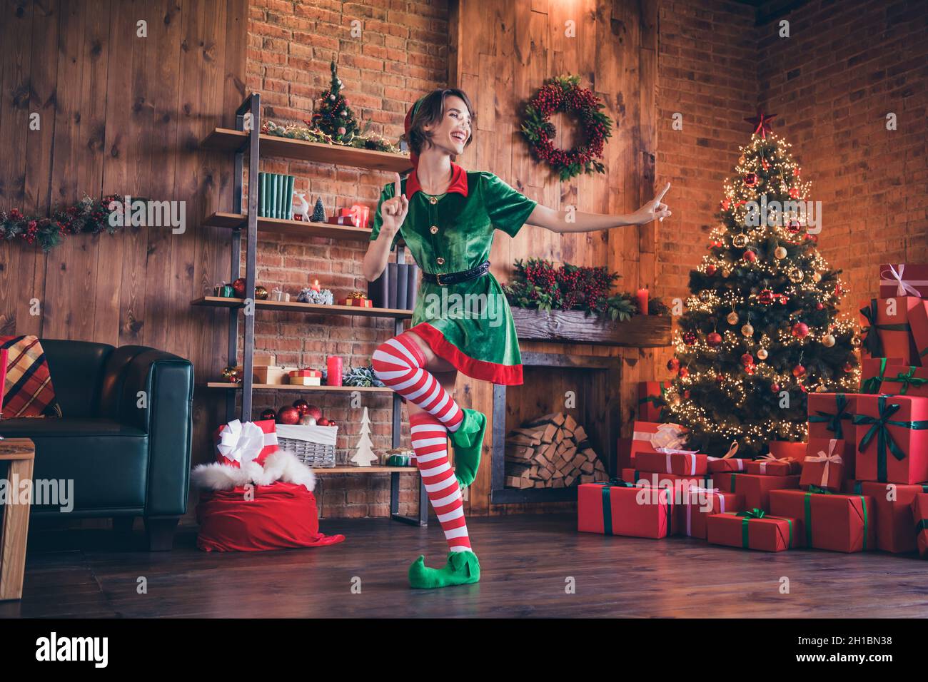 Full size photo of young positive santa helper woman christmas dance ...