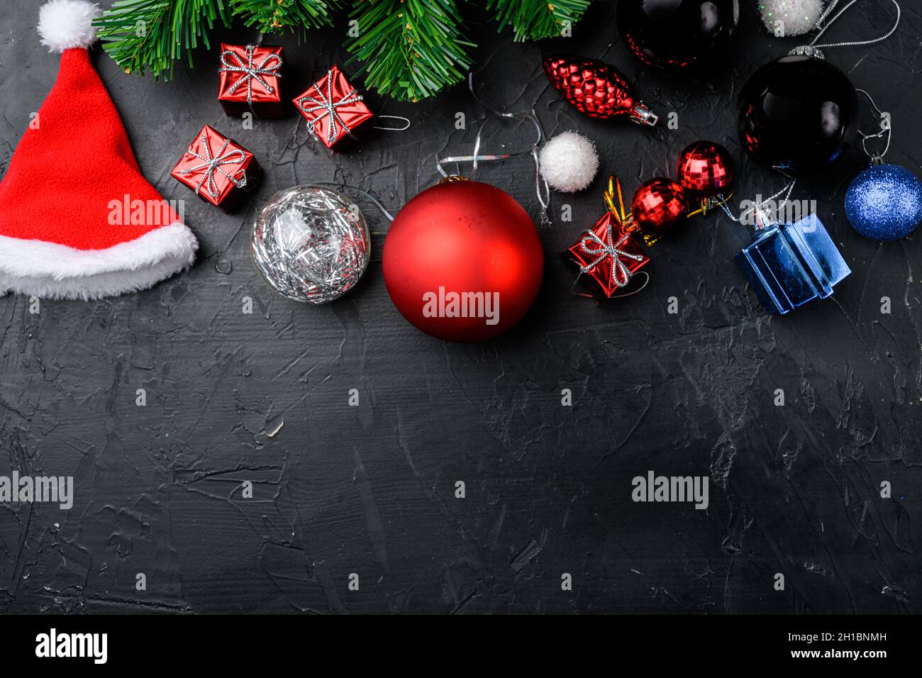 Creative Christmas baubles decoration set, top view flat lay, on black ...