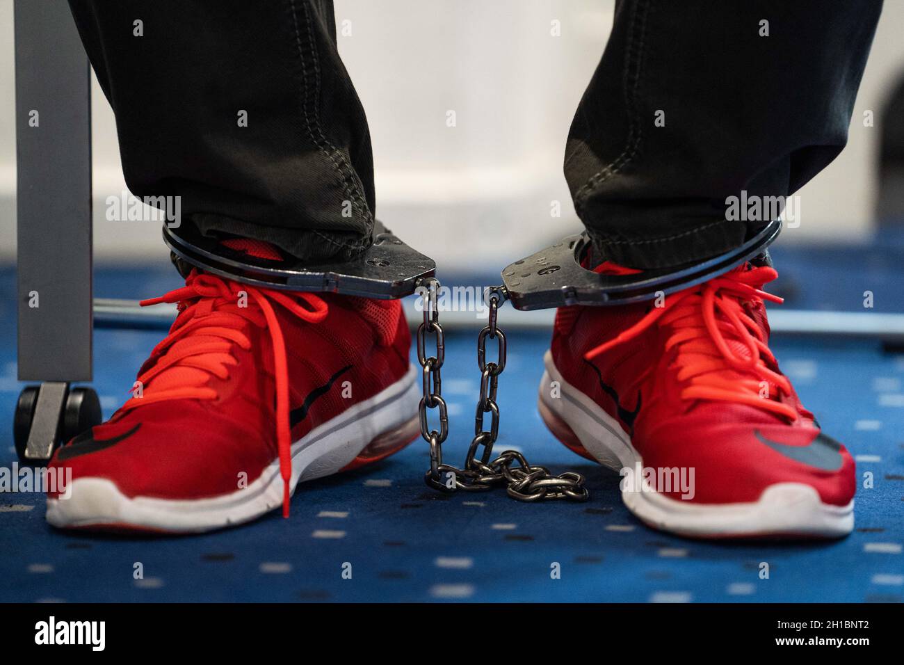 Bamberg, Germany. 18th Oct, 2021. The defendant sits in the courtroom ...