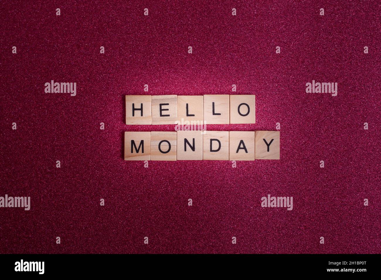 Hello Monday wooden letter alphabet on bright pink background Stock ...