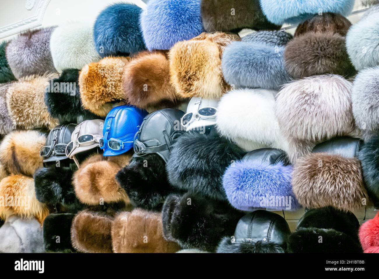 Variety of Russian fur caps souvenirs on display in a touristic ...