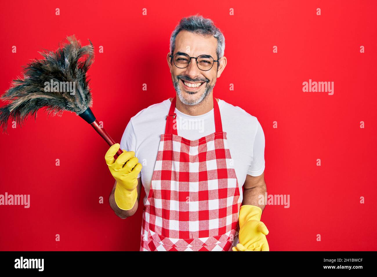 Man holding feather duster hi-res stock photography and images - Alamy
