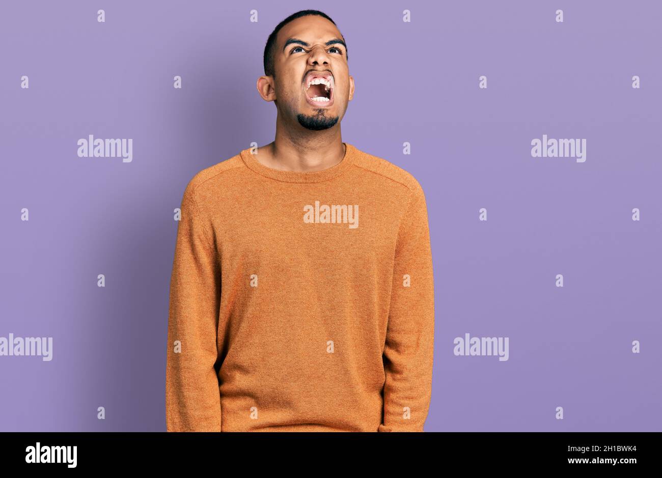 Young african american man wearing casual clothes angry and mad ...