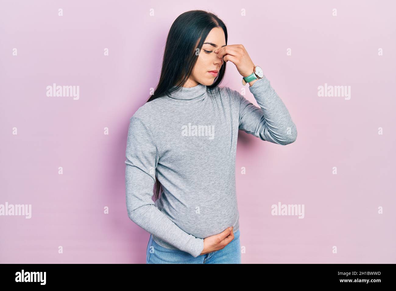 Beautiful woman with blue eyes expecting a baby, touching pregnant ...