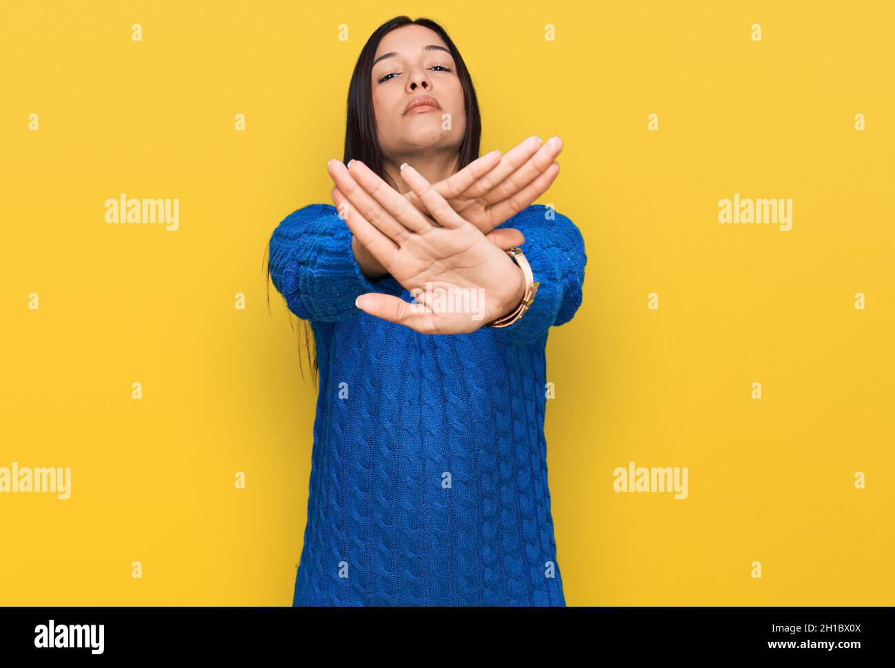 Young hispanic woman wearing casual clothes rejection expression ...
