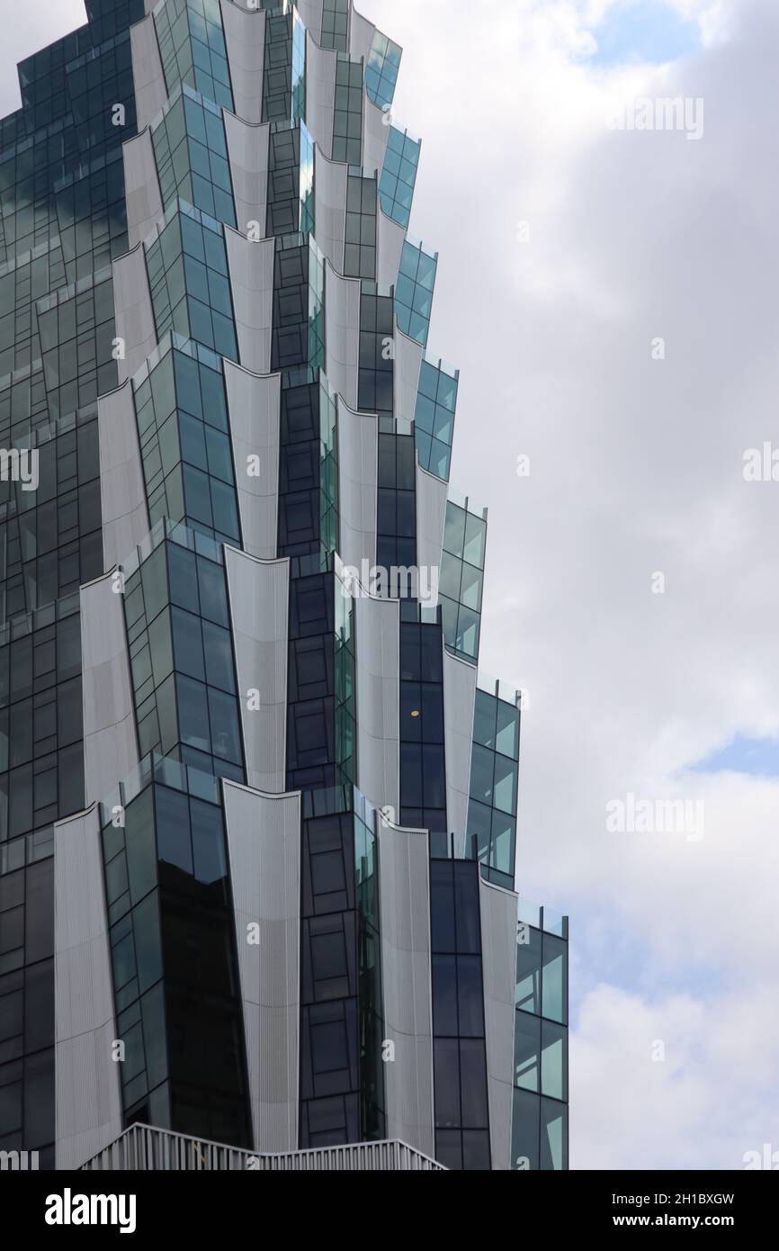 Vertical shot of the side of a skyscraper with unique architecture ...