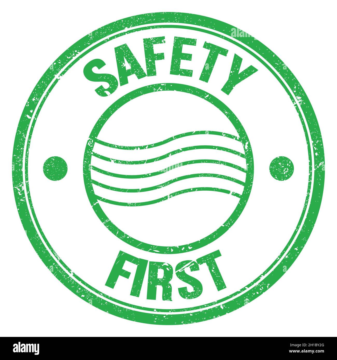 SAFETY FIRST text written on green round postal stamp sign Stock Photo ...