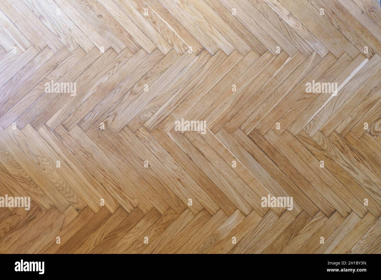 Parquet with herringbone background. Wooden floor with a chevron ...