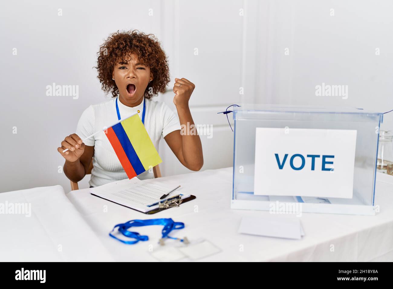 Young african american woman at political campaign election holding ...