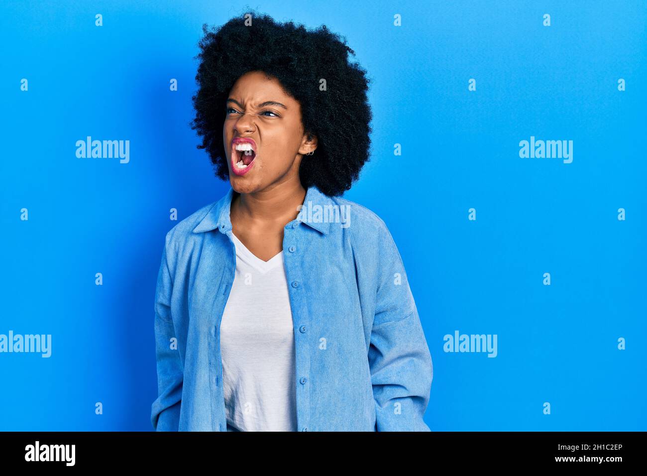 Young african american woman wearing casual clothes angry and mad ...