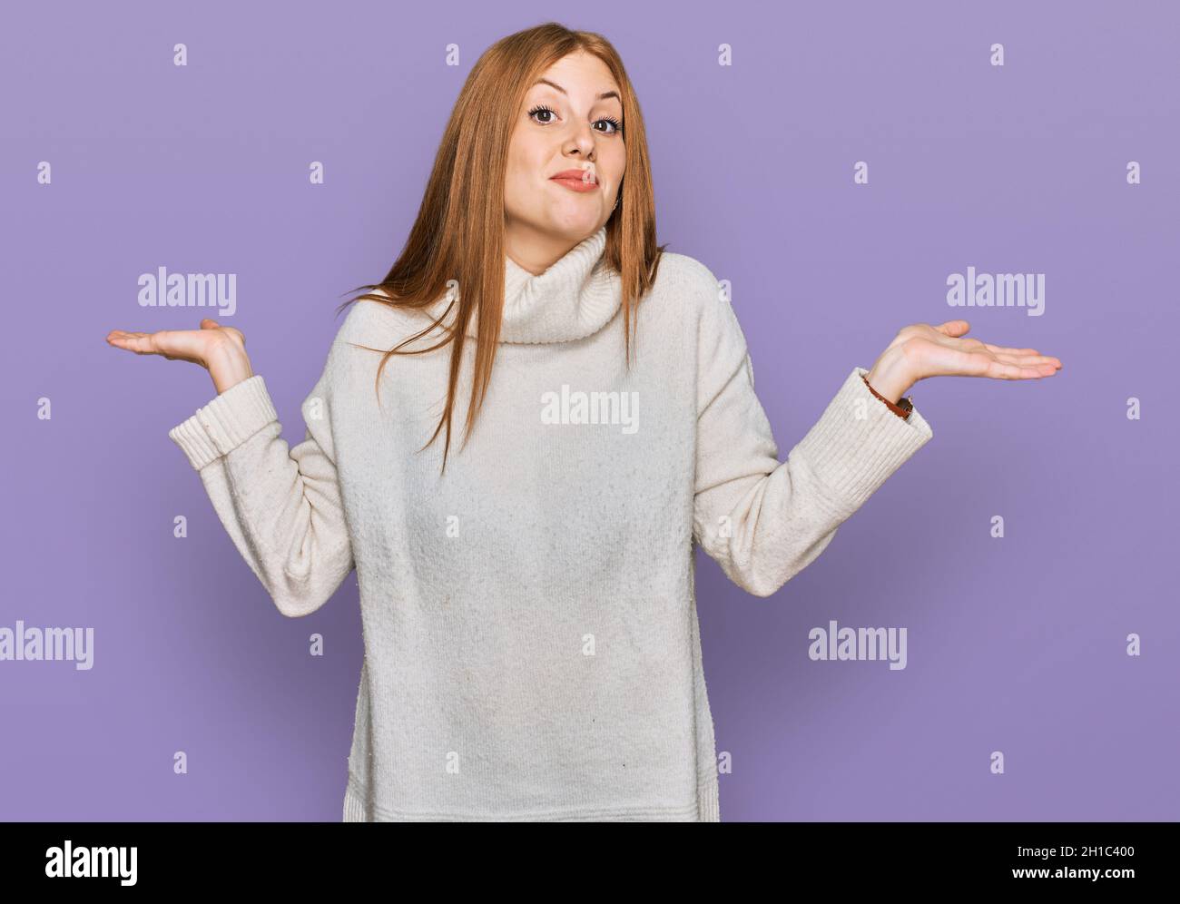 Young irish woman wearing casual winter sweater clueless and confused ...