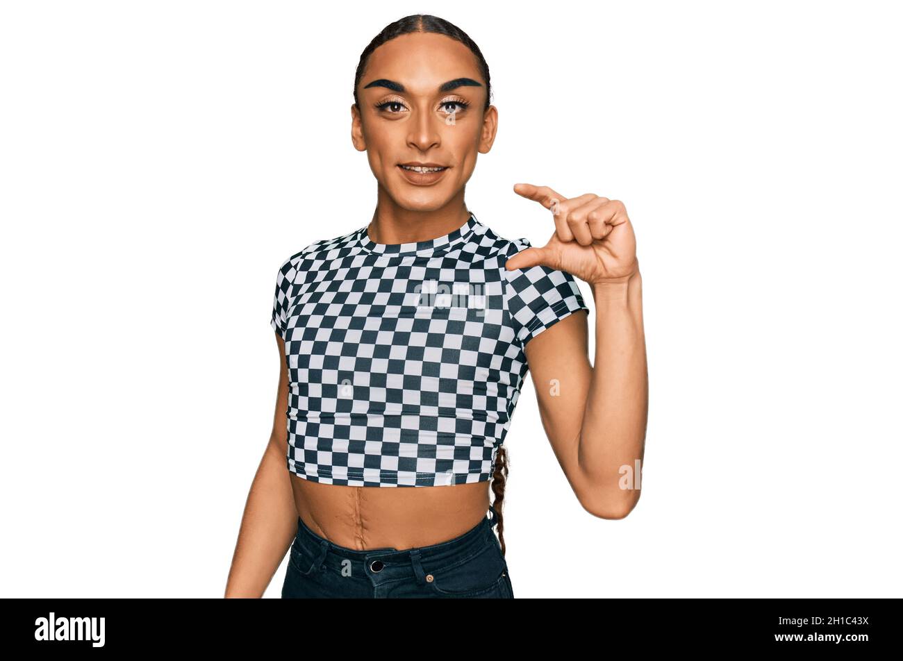 Hispanic transgender man wearing make up and long hair wearing modern ...