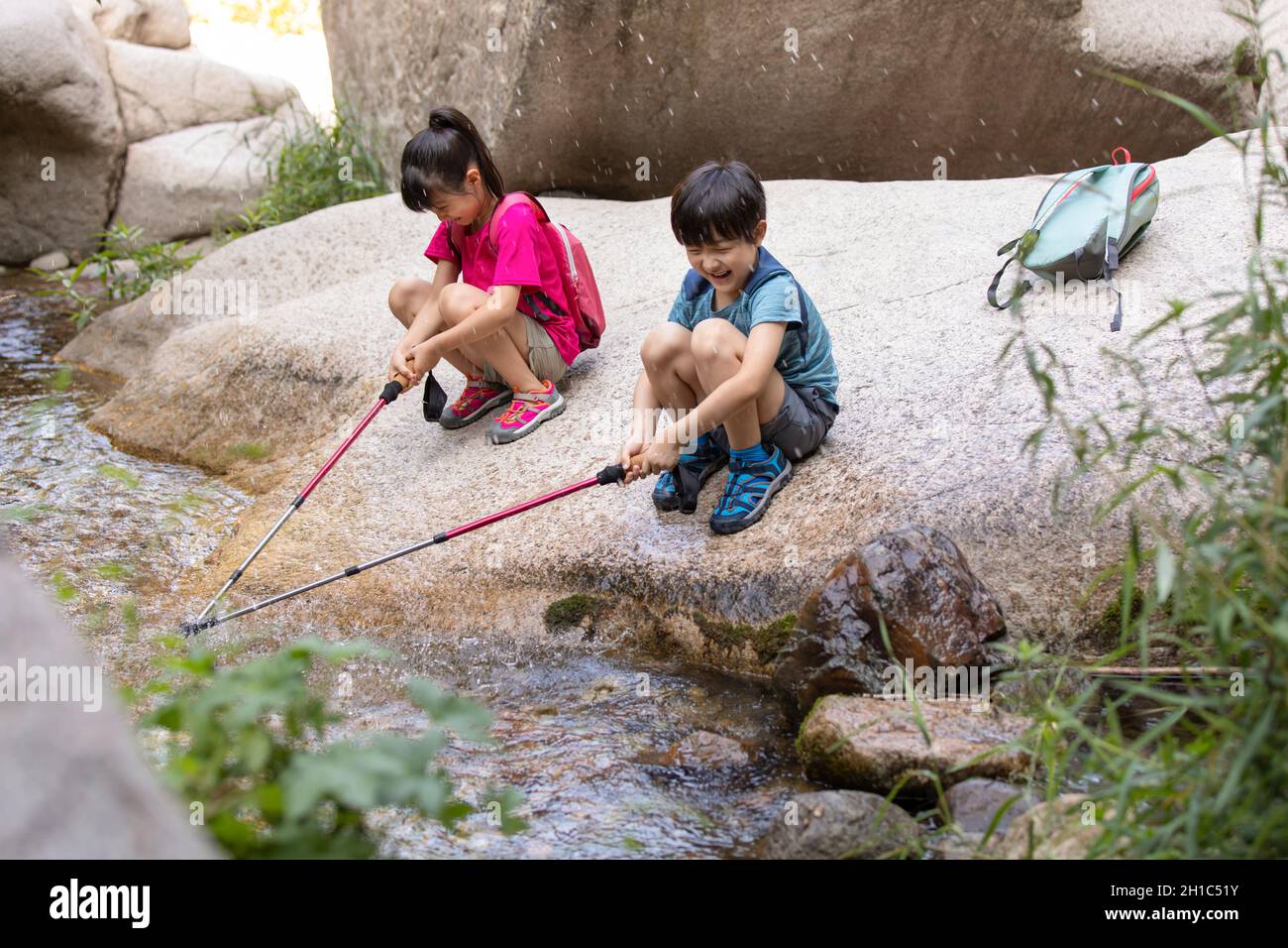 Little children having fun outdoors Stock Photo - Alamy