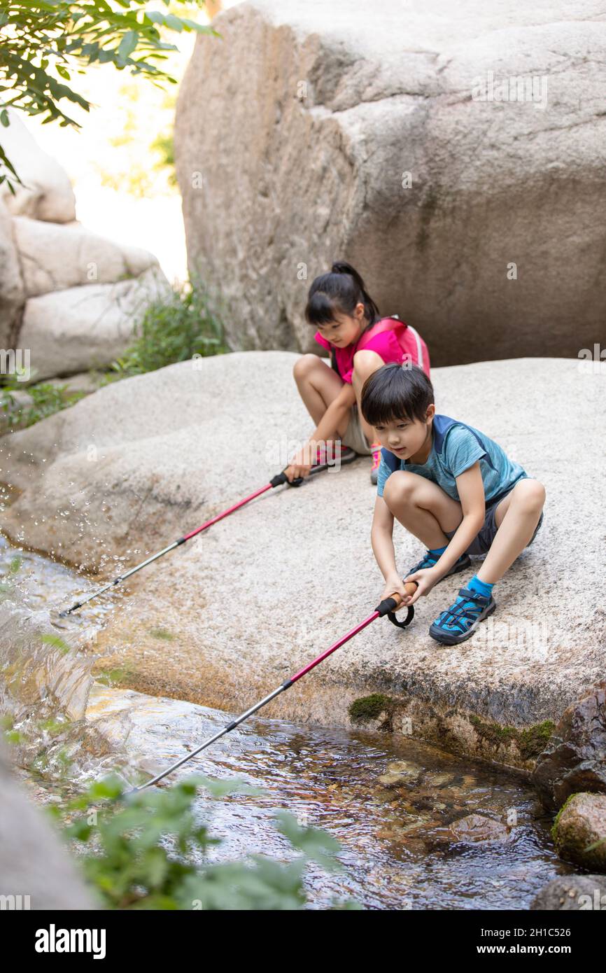 Little children having fun outdoors Stock Photo - Alamy