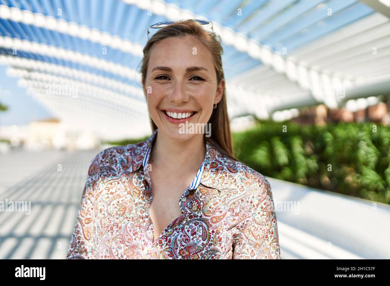 young irish girl smiling happy standing at the city Stock Photo - Alamy