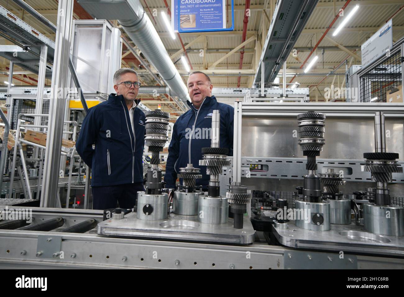 Stuart Rowley president, Ford of Europe (left) talks with plant manager ...