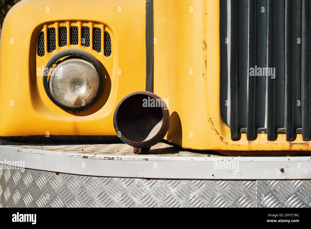 Front view detail of a vintage yellow truck with round headlights Stock ...